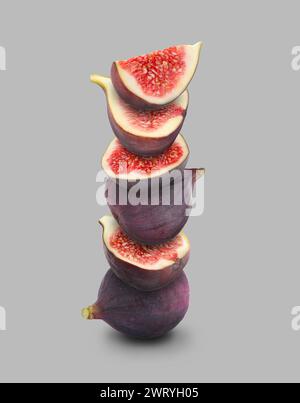 Stacked fresh figs and on grey background, space for text. Banner ...