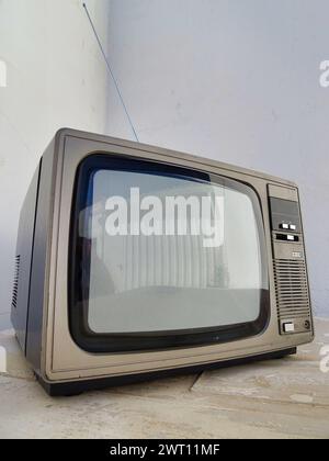 Vintage Television with knobs and buttons isolated over a white ...