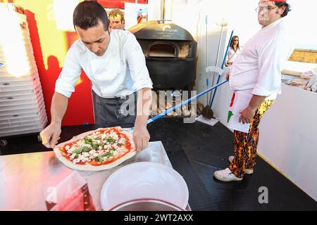 The pizza master, Gino Sorbillo, prepares a pizza on the Caracciolo ...