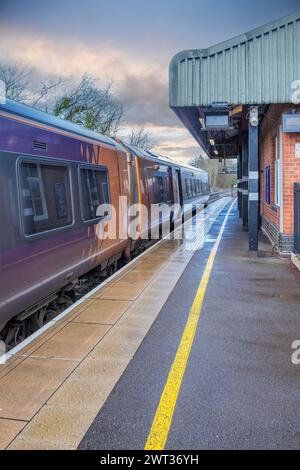 Diesel powered passenger commuter railway train and station. West ...