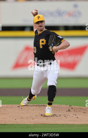 Pittsburgh Pirates starting pitcher Paul Skenes looks down at the ball ...