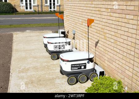 Delivery robots at charging point Stock Photo - Alamy