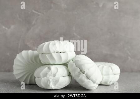 Sweet zefirs on grey background Stock Photo - Alamy