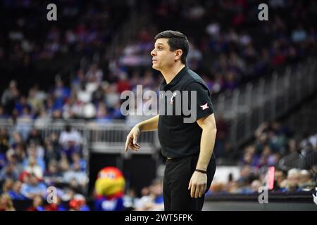 Cincinnati head coach Wes Miller walks onto the court during an NCAA ...