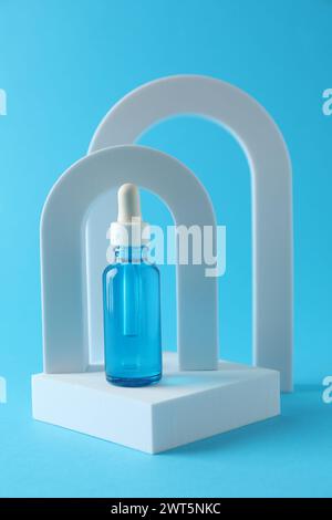 Stylish presentation of serum on light blue background Stock Photo - Alamy