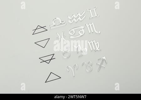 Zodiac triplicity. Four elements and corresponding signs on grey ...