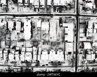 Aerial view of a residential neighborhood covered in a layer of fog ...
