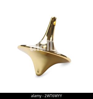 One golden spinning top on grey textured background, closeup. Space for ...