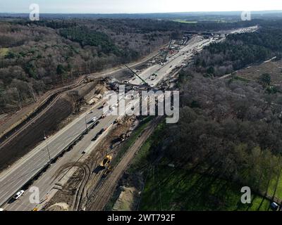 Workman on the section of the M25 between Junctions 10 and 11, in ...