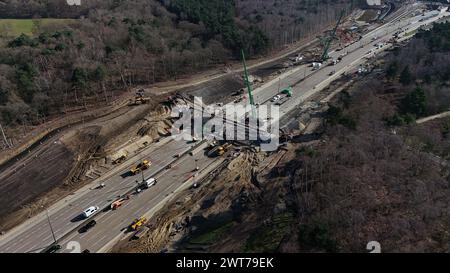 Workman on the section of the M25 between Junctions 10 and 11, in ...