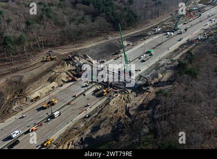 Workman on the section of the M25 between Junctions 10 and 11, in ...