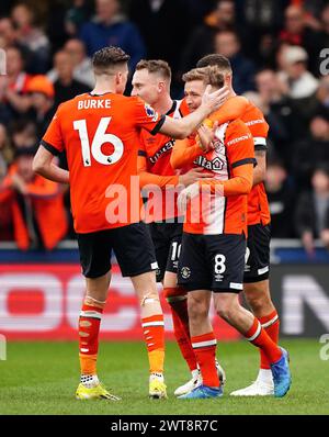 Luton Town's Luke Berry (right) celebrates scoring their first goal of ...