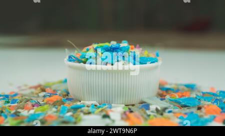 A pile of microplastics inside a plastic bottle cap. Concept for ...