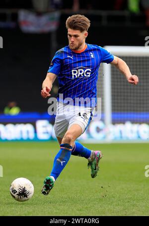 Charlie Raglan of Oldham Athletic Association Football Club is tussling ...