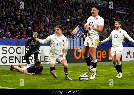 England's Tommy Freeman celebrates scoring their side's third try of ...