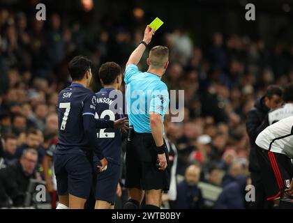 Referee Rob Jones gives a yellow card to Trai Hume of Sunderland during ...