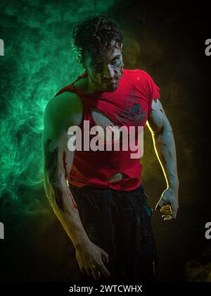 A zombie man wearing a red shirt is shown with blood splattered all ...