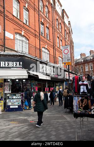 Brixton market with elegant red-brick houses above the shops, Electric ...