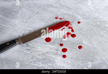 Bloody knife lies on messy background. Homicide Domestic Violence ...