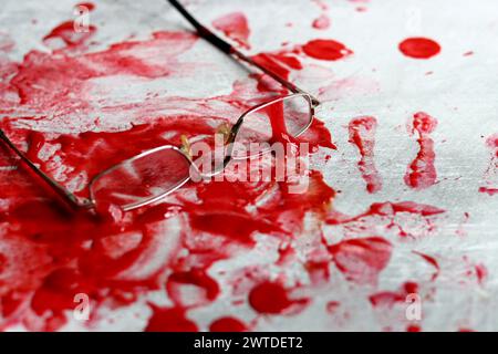 Bloody messy scene. Cloe up photo of blood splatter on light grey ...
