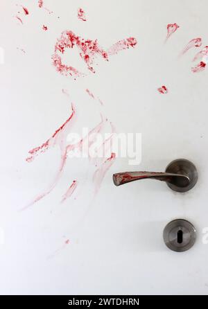 Blood on the door handle of a white door, Halloween theme, Violence ...