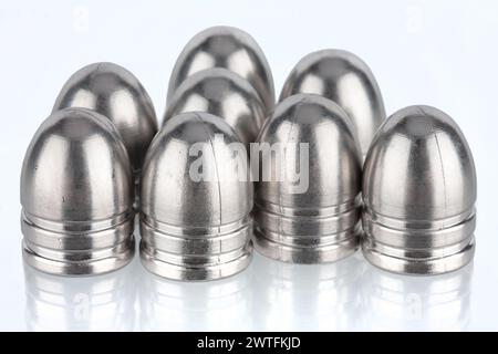 silver bullets for muzzle guns on white background Stock Photo - Alamy