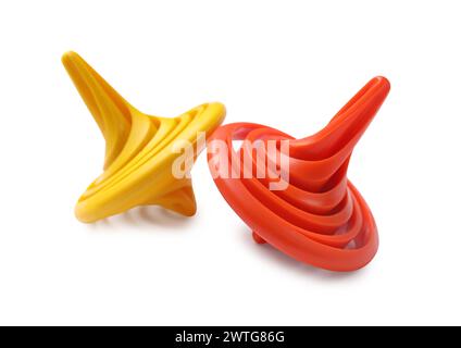 Two colorful spinning tops on white background Stock Photo - Alamy