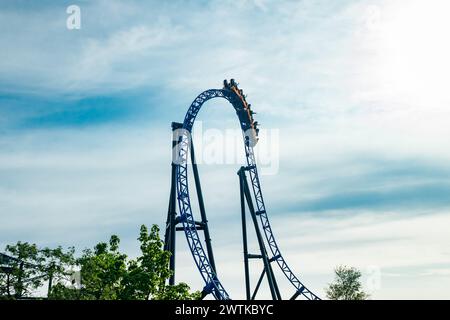 Ride roller coaster in motion in amusement park Stock Photo - Alamy
