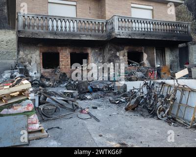 Detail of charred and burned personal objects after a house fire in ...