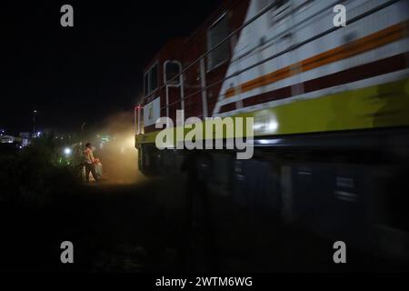A commuter train passes through Kibera Railway Station. Kibera, the ...