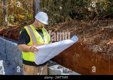 Construction worker with used building materials in room prepared for ...