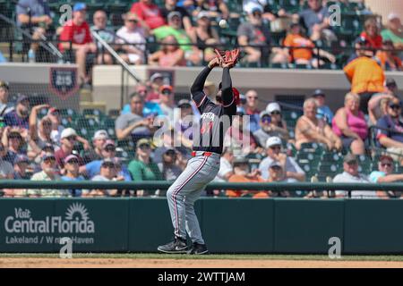 Detroit Tigers third baseman Carson Rucker (59) throws to first base ...