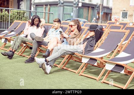 Female friends relaxing outdoor Stock Photo - Alamy