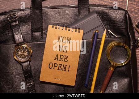 Business concept. On the business charts there is a notepad, a pen and ...