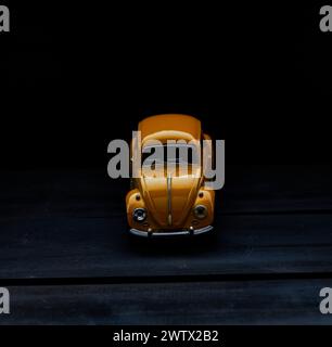 Old retro little yellow car stands in a field in Europe Italy 2013 ...