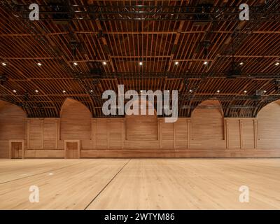 Timber lined empty auditorium with arched window structures. Brighton ...