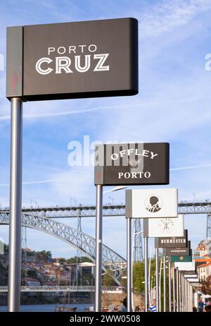 Port signs and Dom Luis I bridge Vila Nova de Gaia Porto Portugal Stock ...