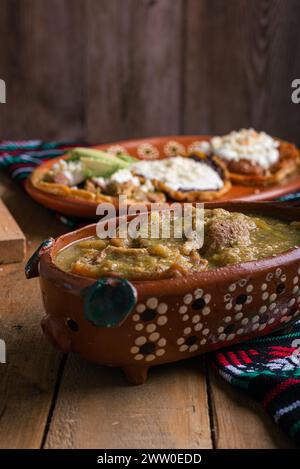 Chicharrones in green sauce, typical mexican food. Mexican food in clay ...