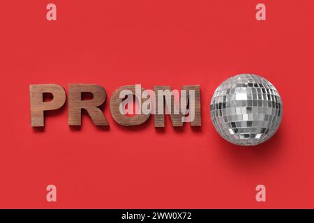Word PROM with disco ball on dark table against blurred lights Stock ...