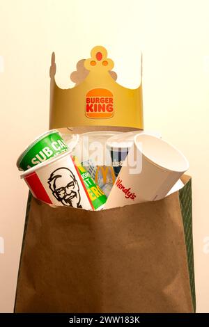A trash bag full of fast food drink containers from a variety of fast ...