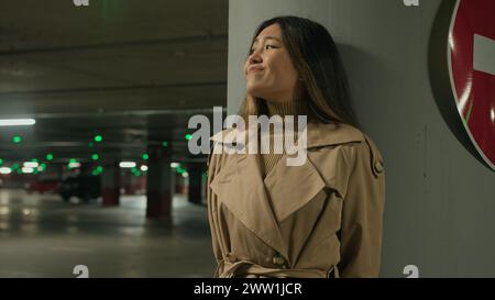 Frightened Asian ethnic chinese korean woman hiding from danger pursuit ...