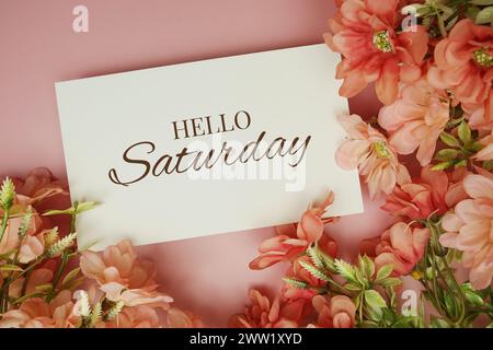 Hello Saturday typography text with flowers on pink background Stock ...