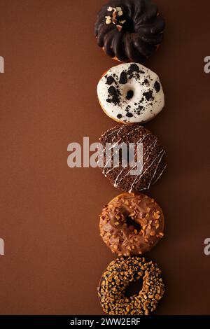 A row of donuts with different toppings Stock Photo - Alamy