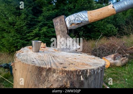 Axe for making fire wood for the campfire Stock Photo - Alamy