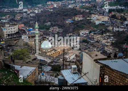 Akre, Iraq. 20th Mar, 2024. An Iraqi Kurdish man carries a fire torch ...