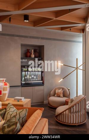 Communal living space with dining table and games and a bar area ...