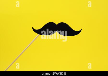 Fake paper mustache on stick against white background Stock Photo - Alamy