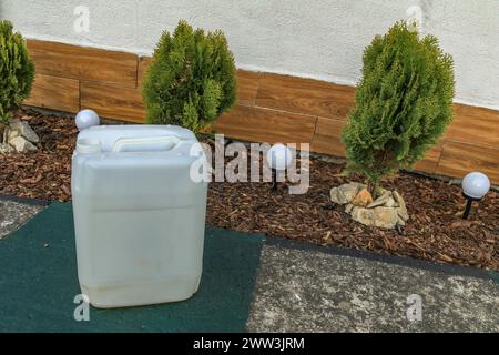 Chemicals in a canister, fertilizer for watering plants in the garden ...