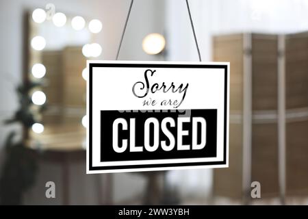 Sorry we are closed sign against blurred background Stock Photo - Alamy