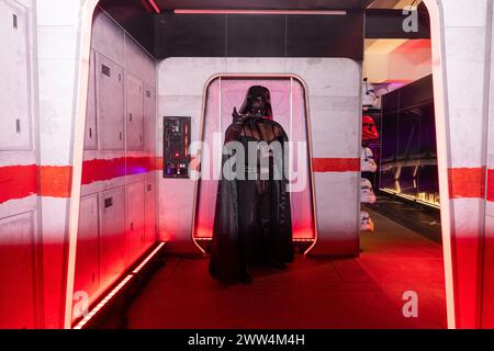 A Darth Vader costumed character poses at the Hasbro and Amazon Star ...
